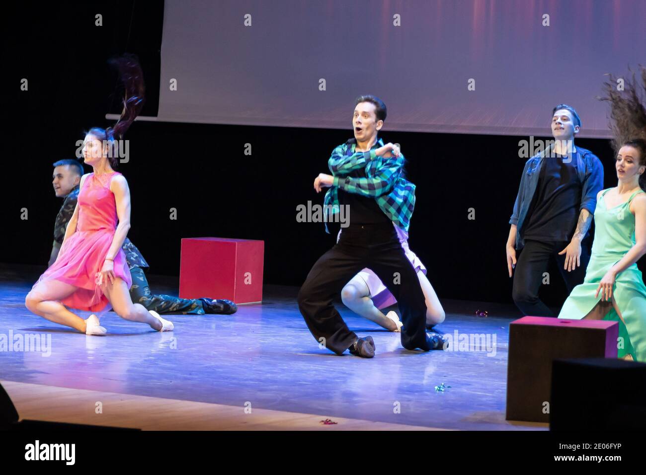 Team Actors dancers perform in the theater on stage in a retro musical ...