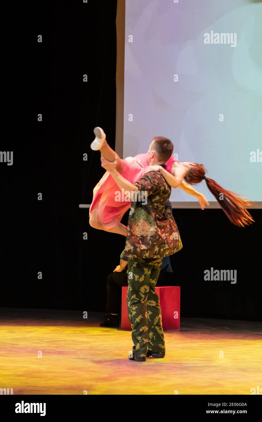 Team Actors dancers perform in the theater on stage in a retro musical ...