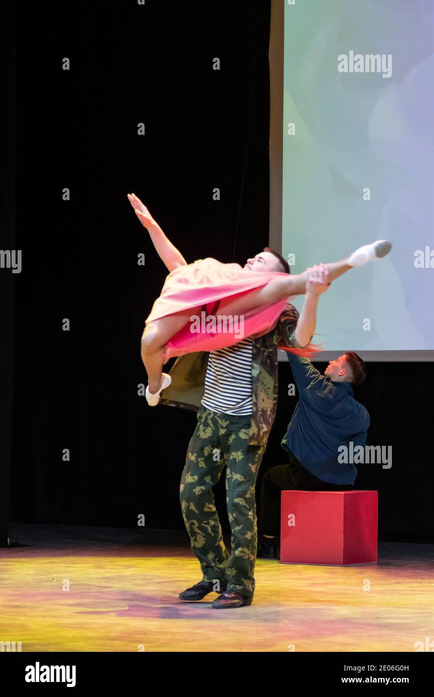 Team Actors dancers perform in the theater on stage in a retro musical ...
