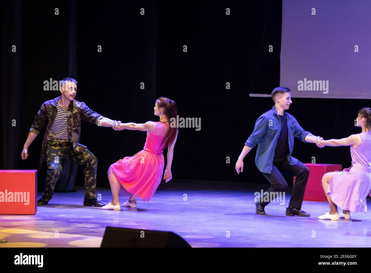Team Actors dancers perform in the theater on stage in a retro musical ...