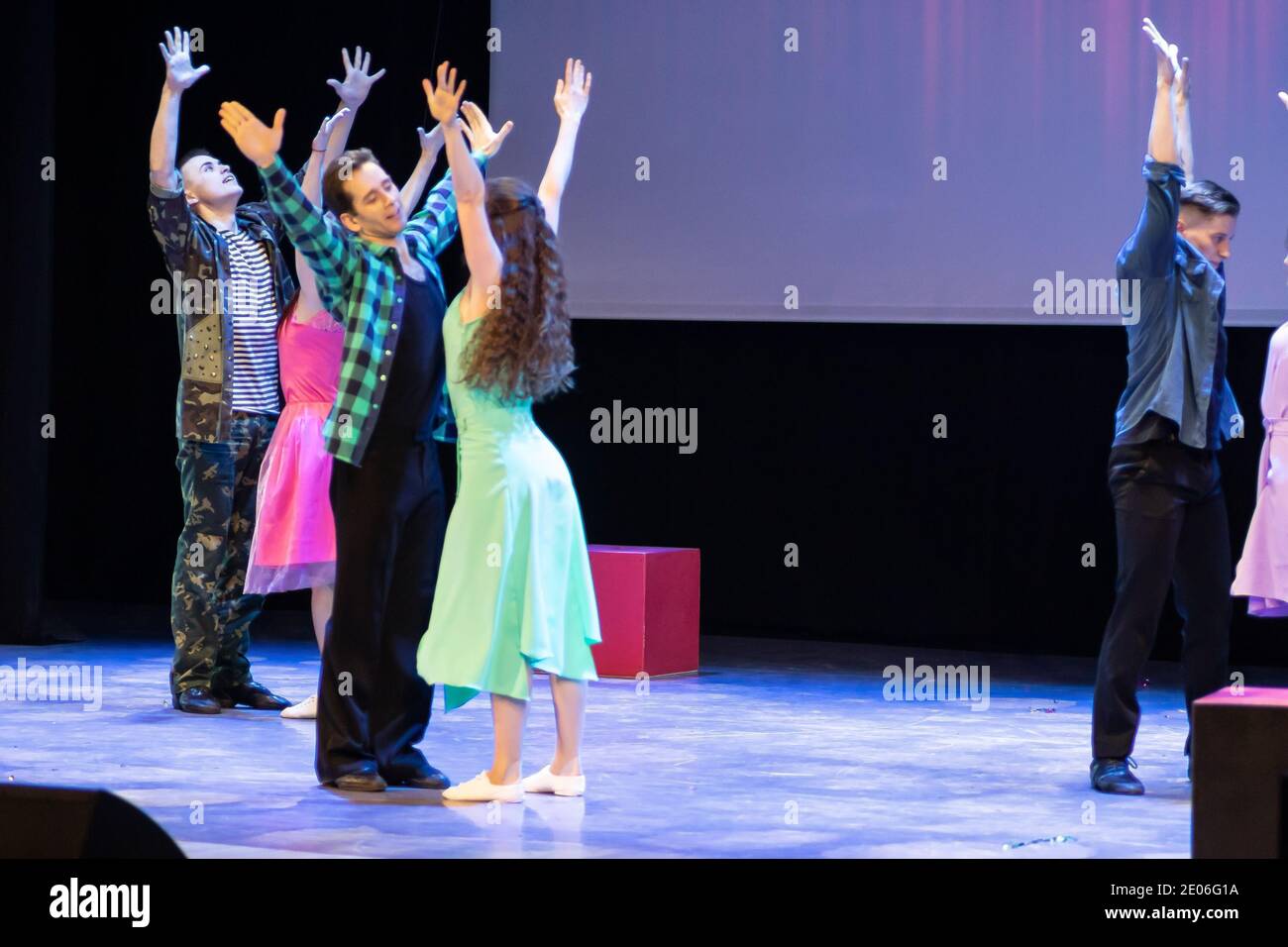 Team Actors dancers perform in the theater on stage in a retro musical ...