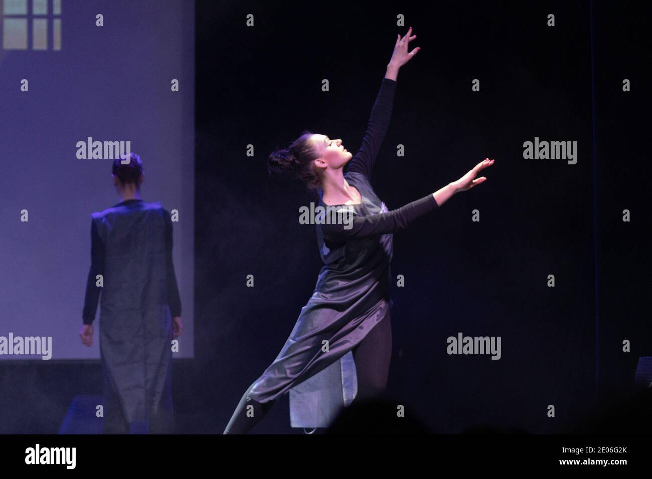 Team Actors dancers perform in the theater on stage in a retro musical ...