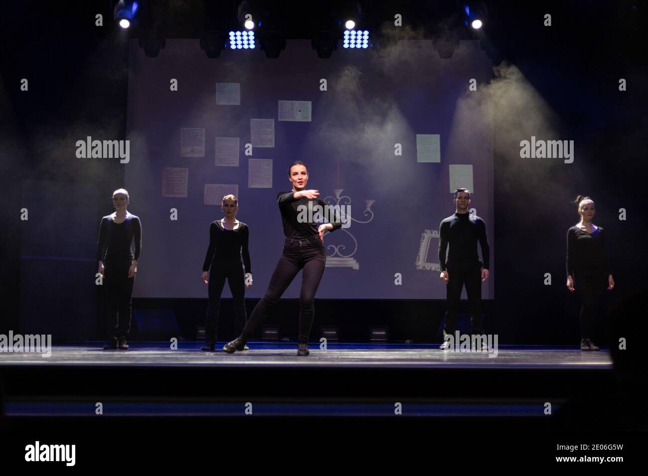 Team Actors dancers perform in the theater on stage in a retro musical ...