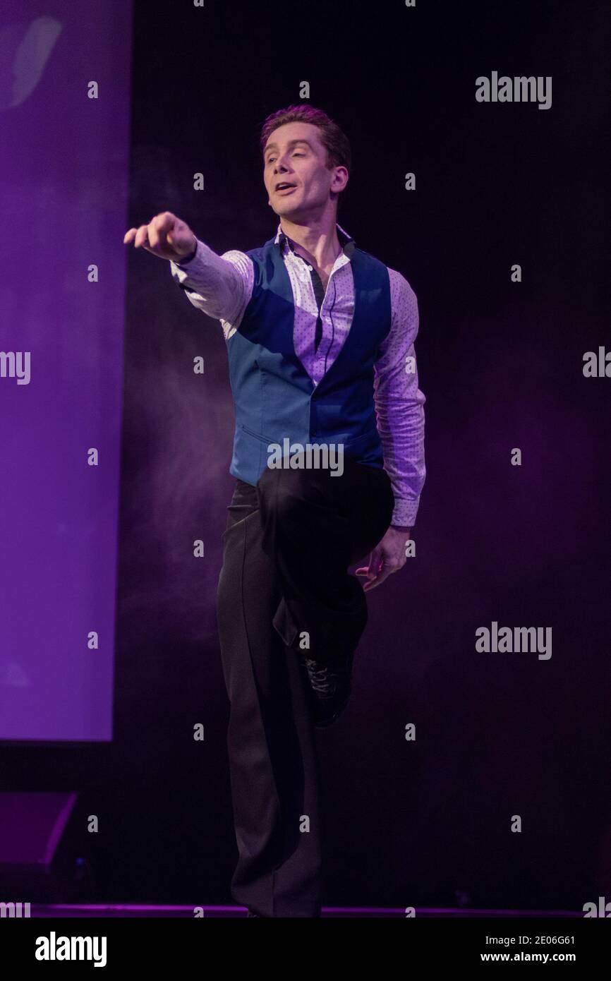 Actor dancer young man performs in the theater on stage in a dance ...