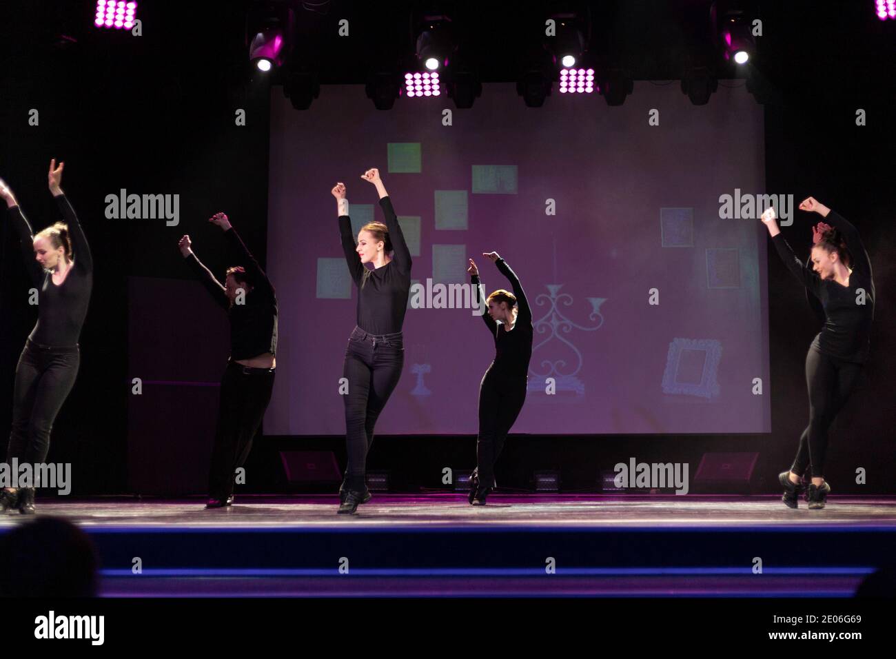 Team Actors dancers perform in the theater on stage in a retro musical ...