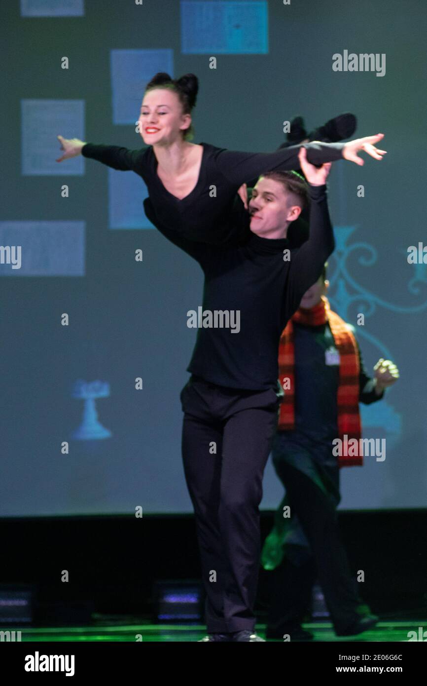 Team Actors dancers perform in the theater on stage in a retro musical ...