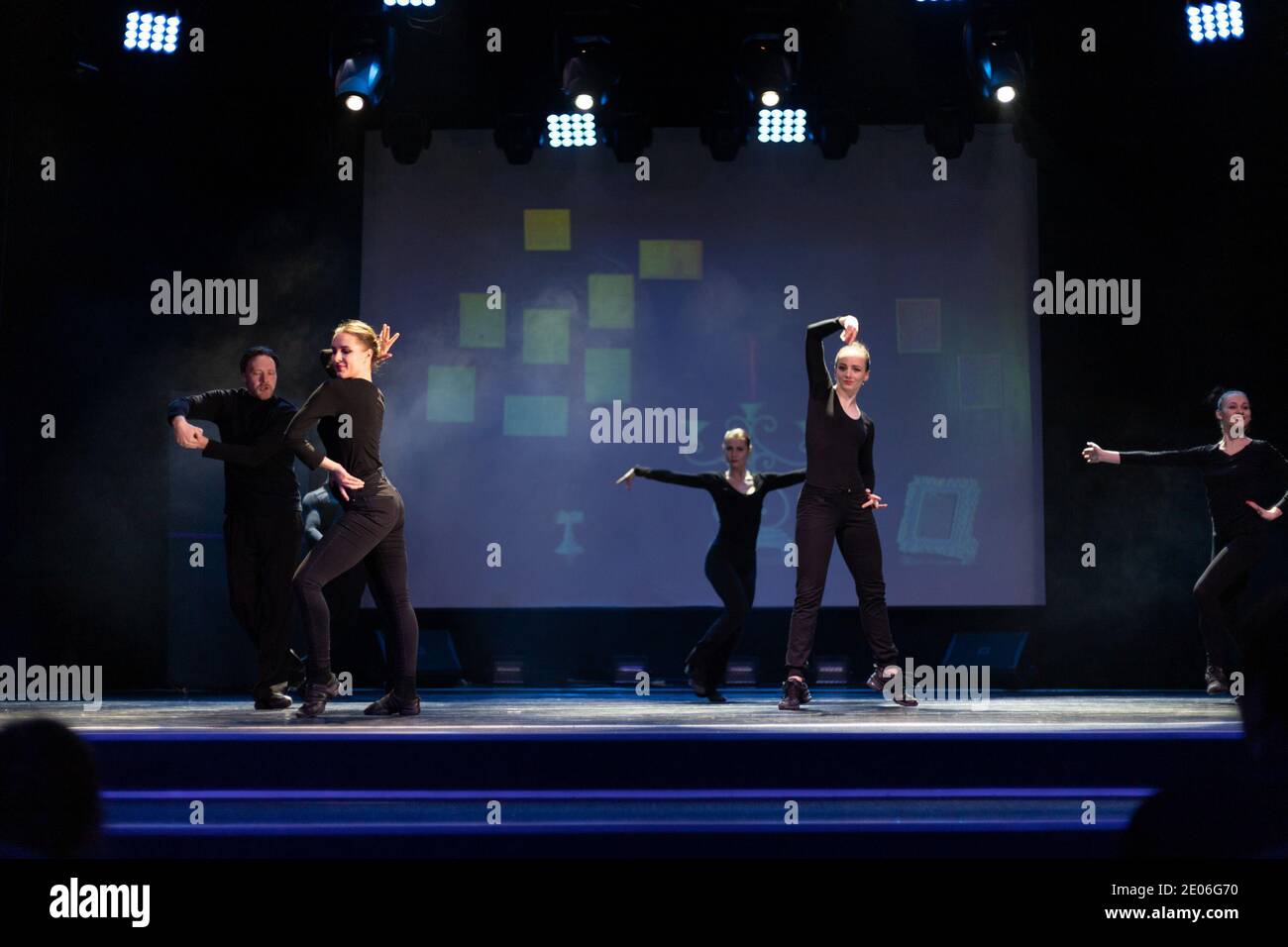 Team Actors dancers perform in the theater on stage in a retro musical ...