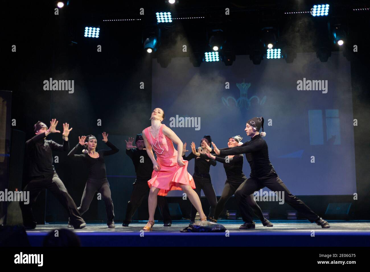 Team Actors dancers perform in the theater on stage in a retro musical ...