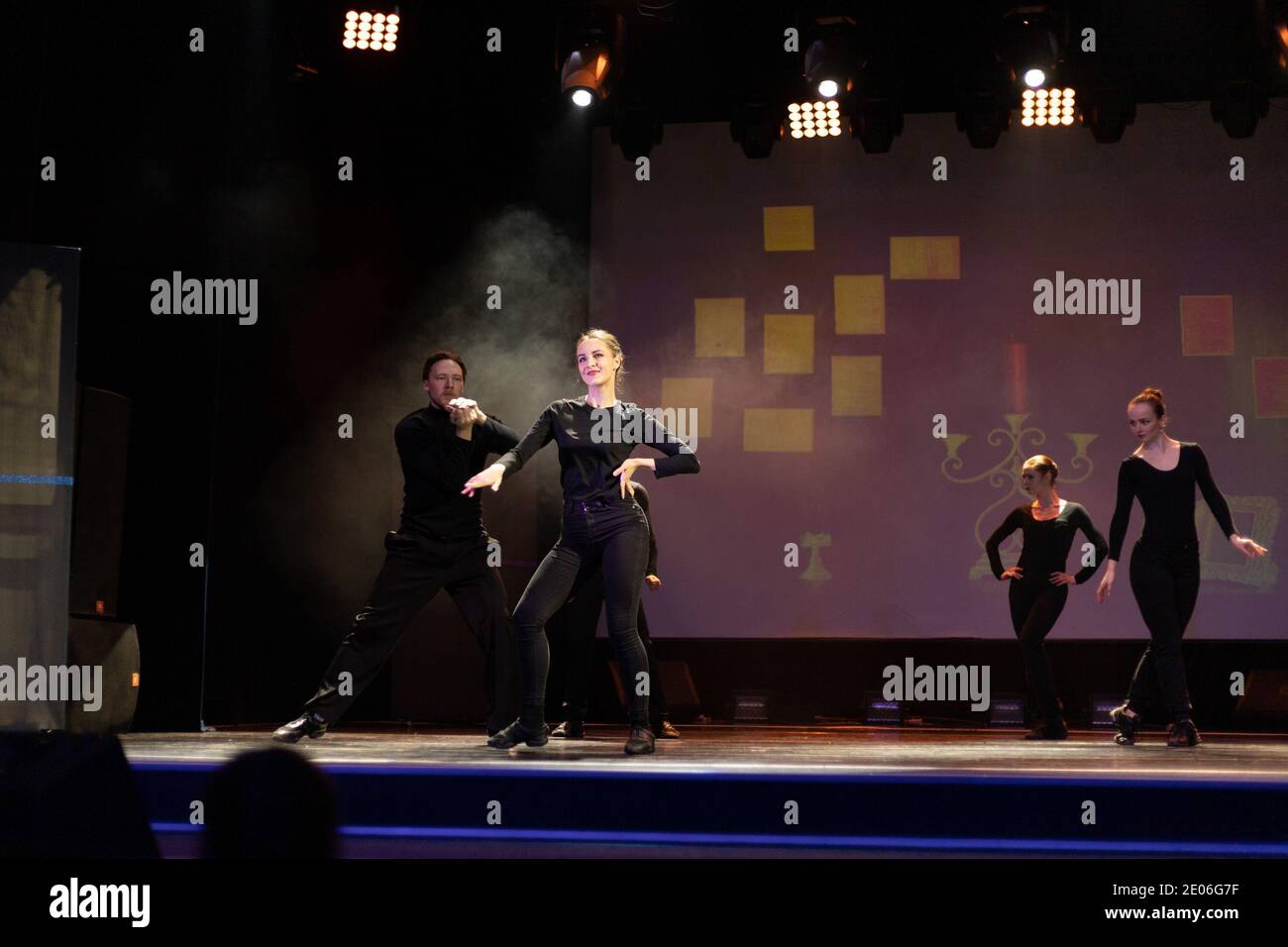 Team Actors dancers perform in the theater on stage in a retro musical ...
