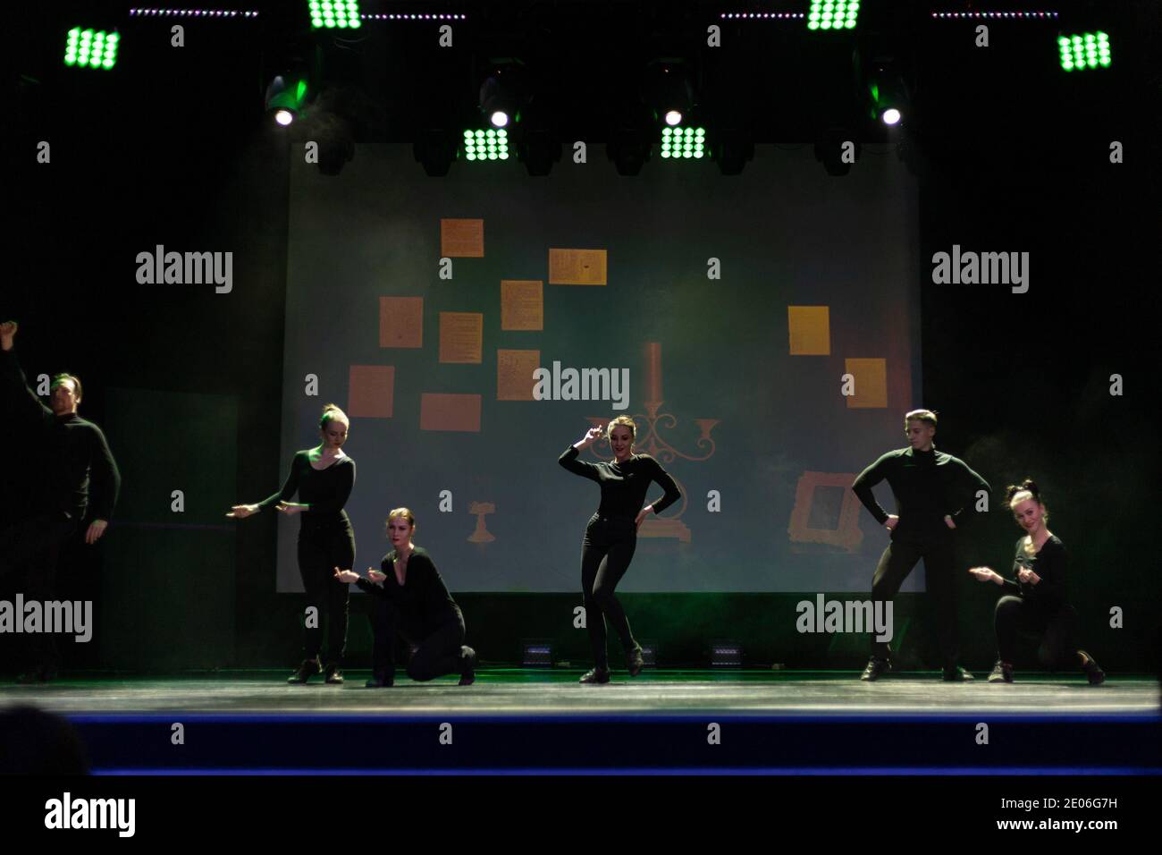 Team Actors dancers perform in the theater on stage in a retro musical ...