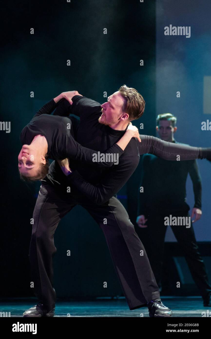 Team Actors dancers perform in the theater on stage in a retro musical ...