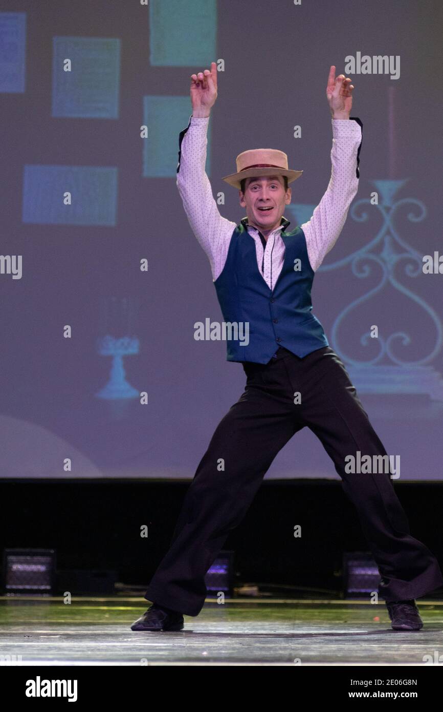 Actor dancer young man performs in the theater on stage in a dance ...