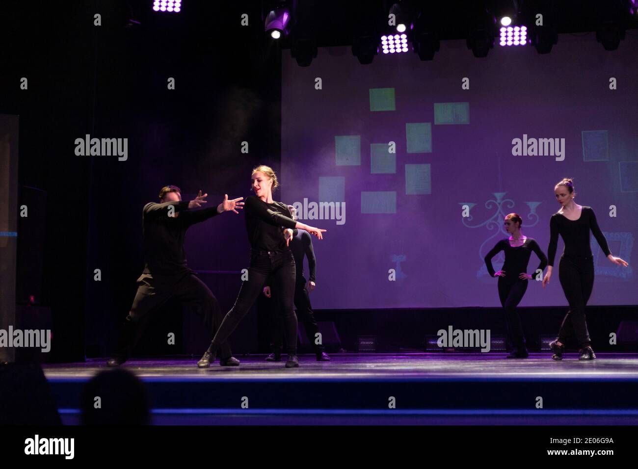 Team Actors dancers perform in the theater on stage in a retro musical ...