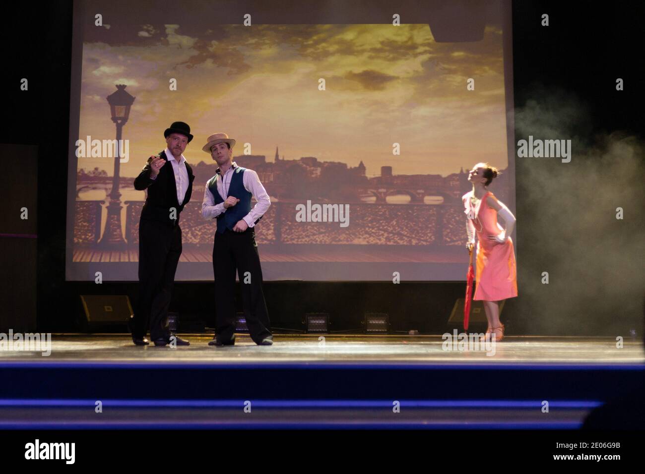 Team Actors dancers perform in the theater on stage in a retro musical ...