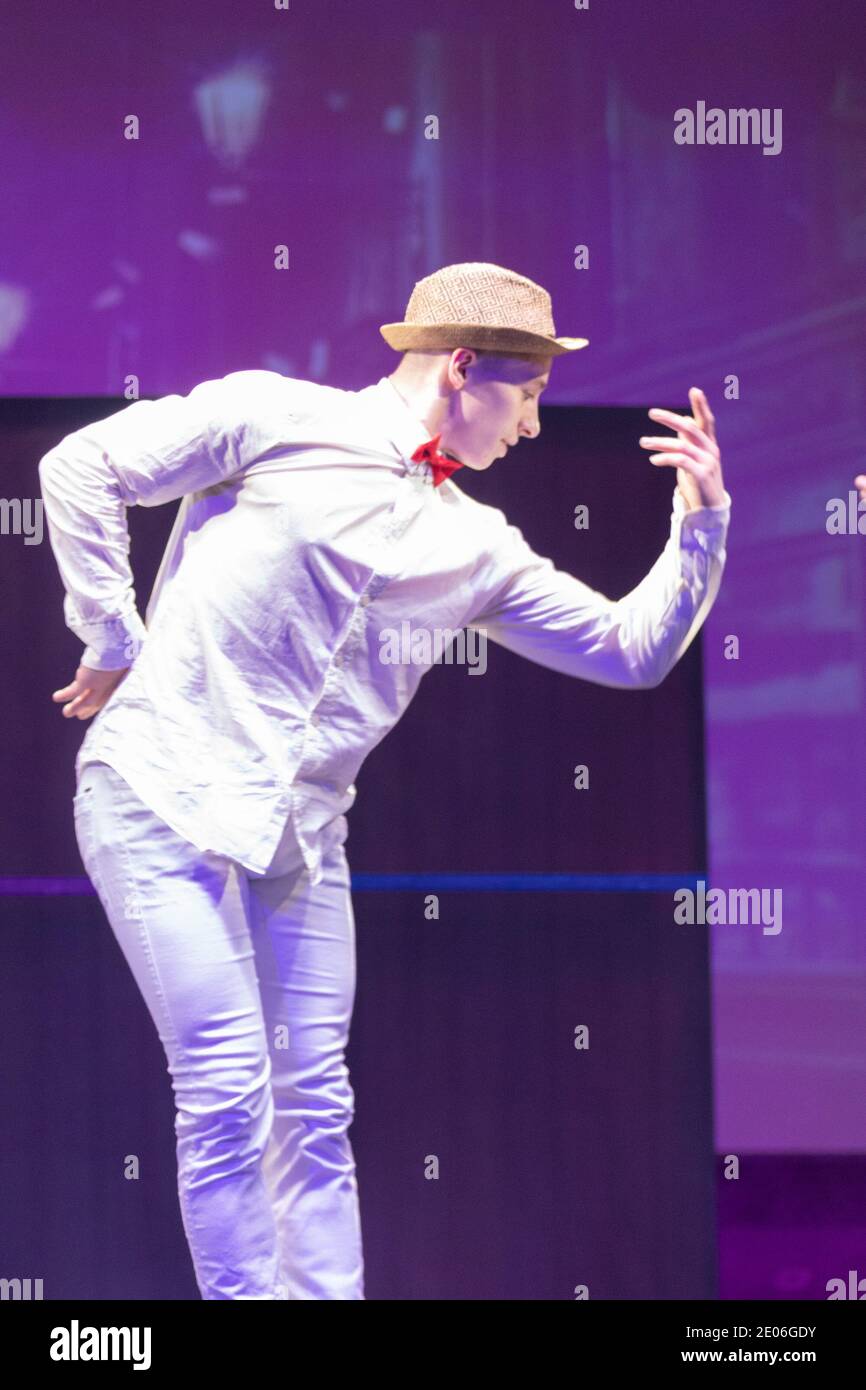 Actor dancer young man performs in the theater on stage in a retro ...