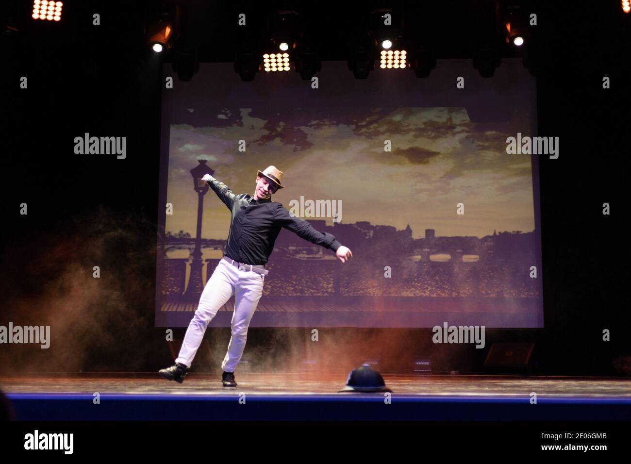 Actor dancer young man performs in the theater on stage in a retro ...