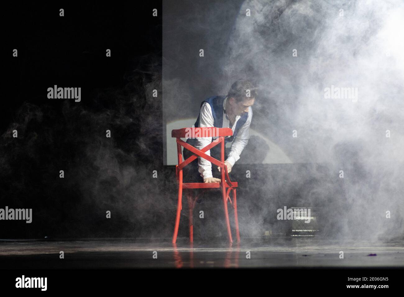 Actor dancer young man performs in the theater on stage in a retro ...