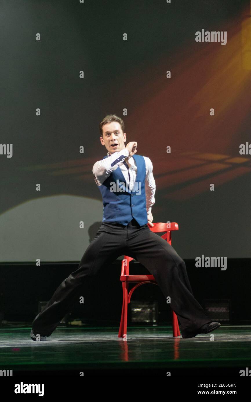 Actor dancer young man performs in the theater on stage in a retro ...
