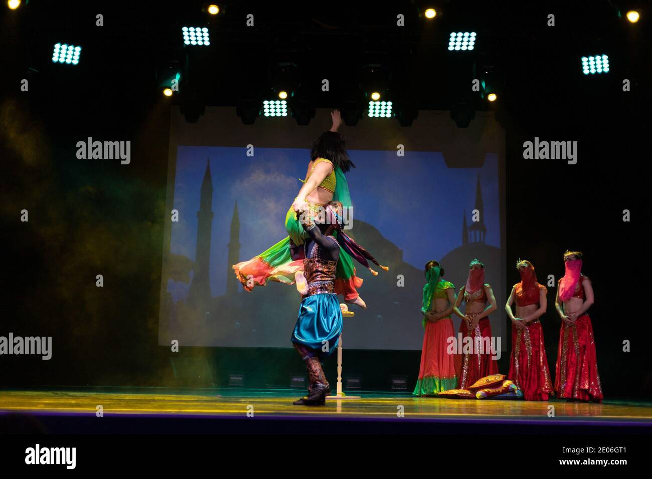 Dancers actors in Oriental Bellydance costumes perform in theater on ...
