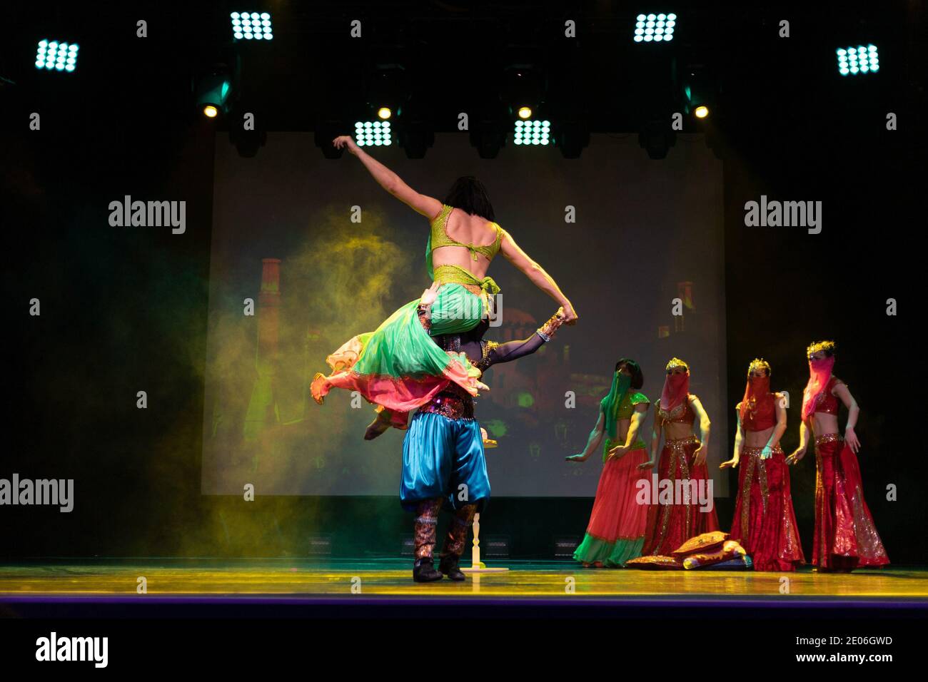 Dancers actors in Oriental Bellydance costumes perform in theater on ...