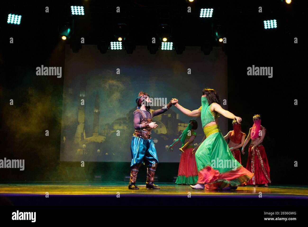 Dancers actors in Oriental Bellydance costumes perform in theater on ...