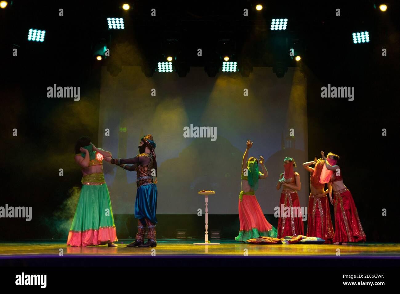Dancers actors in Oriental Bellydance costumes perform in theater on ...
