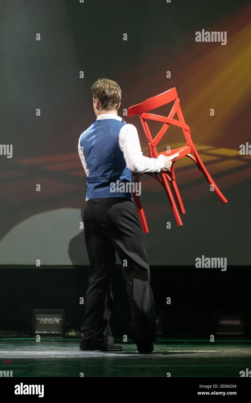 Actor dancer young man performs in the theater on stage in a retro ...