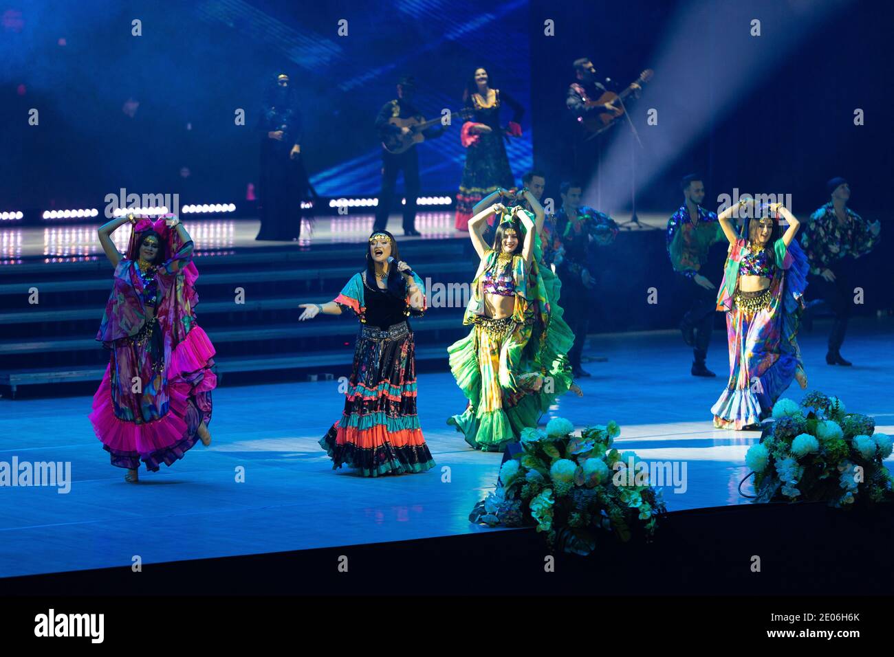 A team of musicians, singers and dancers in gypsy costumes singing and ...