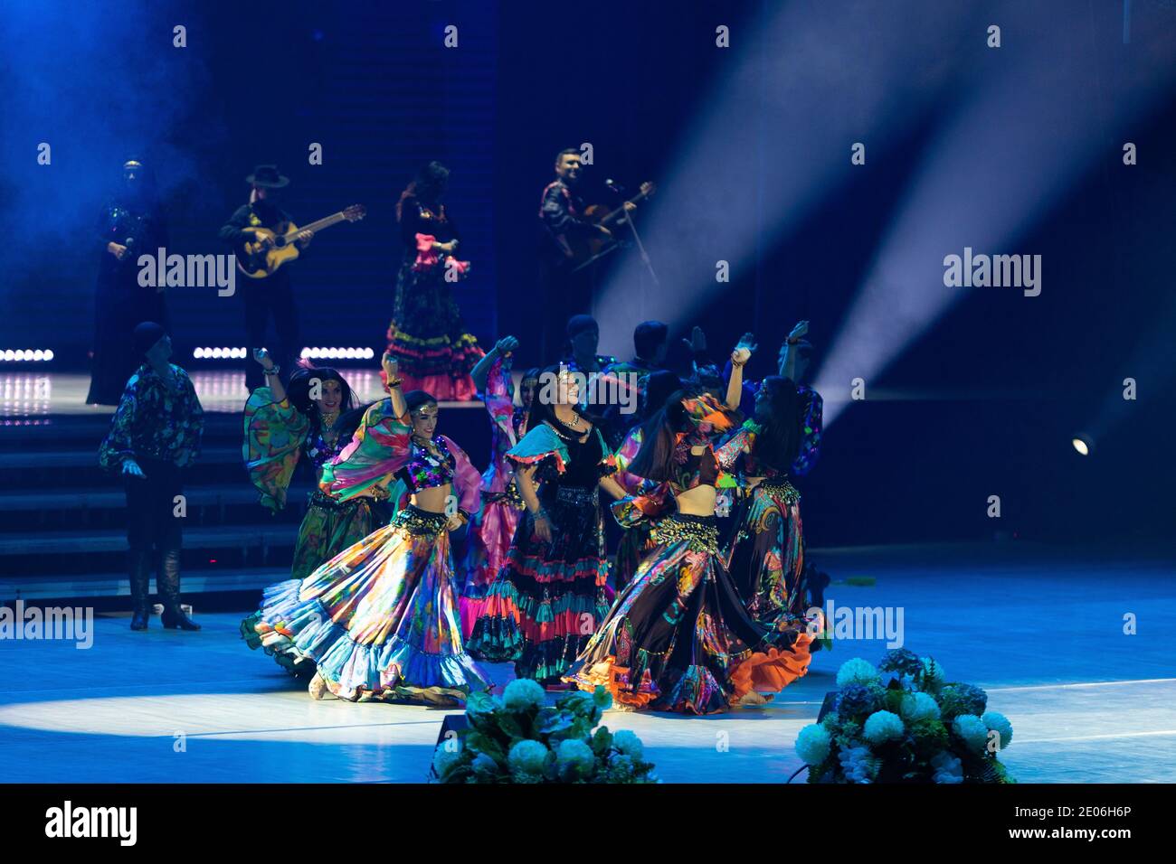 A team of musicians, singers and dancers in gypsy costumes singing and ...