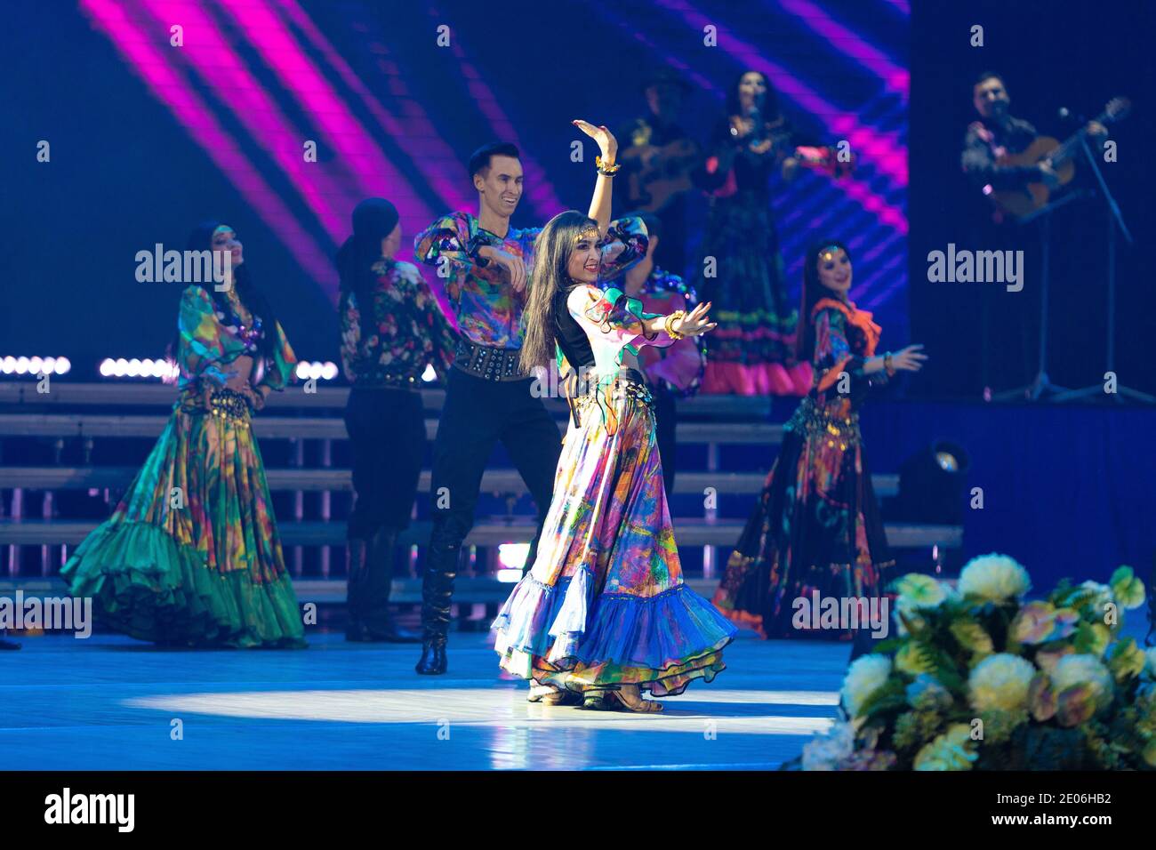 A team of musicians, singers and dancers in gypsy costumes singing and ...