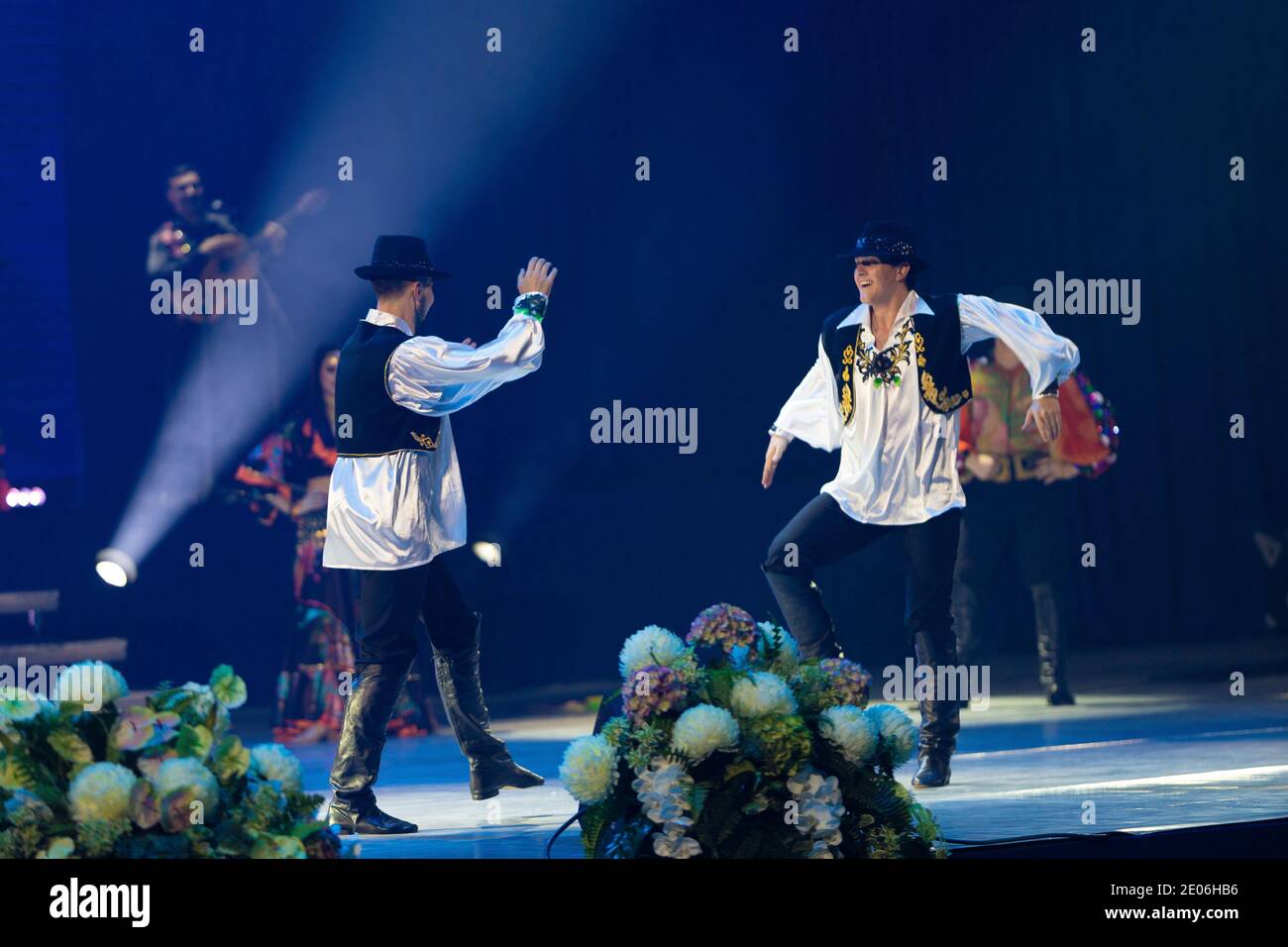 A team of musicians, singers and dancers in gypsy costumes singing and ...