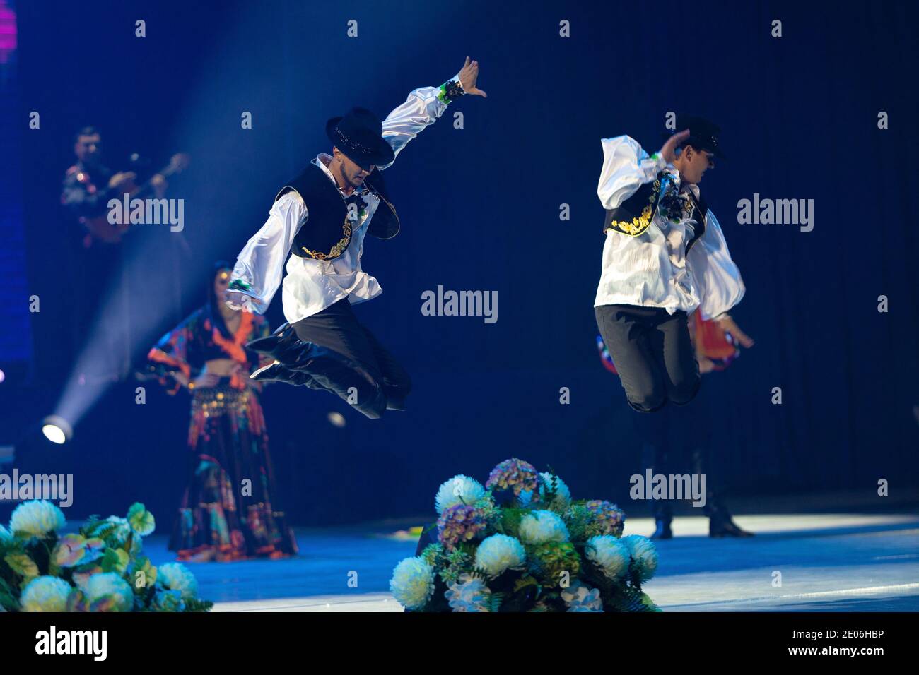 A team of musicians, singers and dancers in gypsy costumes singing and ...