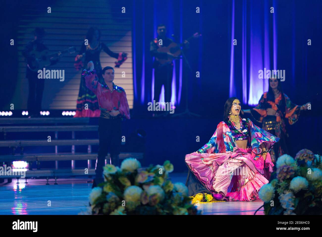 A team of musicians, singers and dancers in gypsy costumes singing and ...