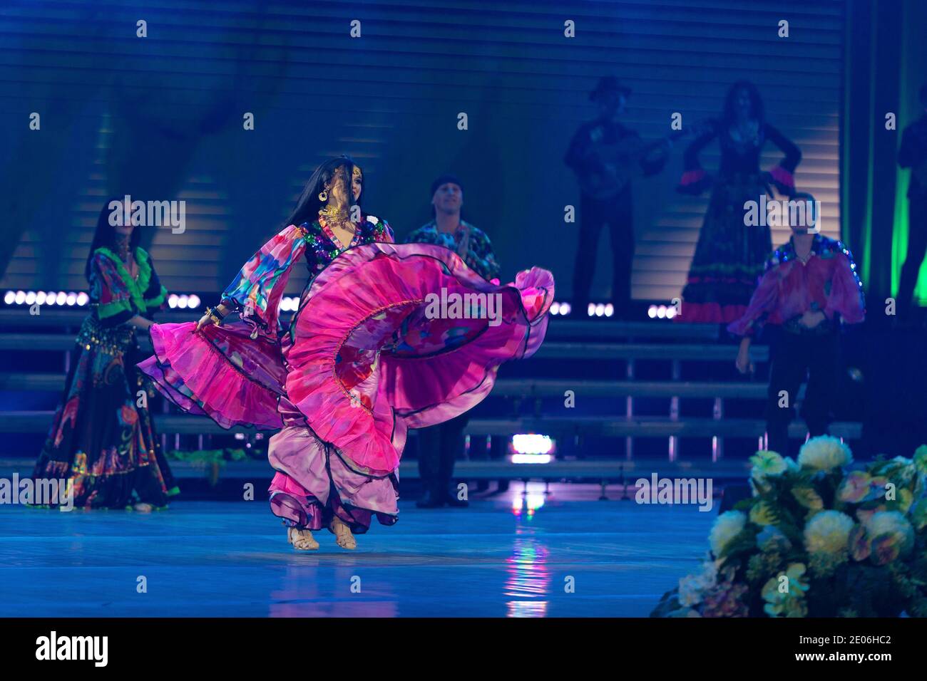 A team of musicians, singers and dancers in gypsy costumes singing and ...