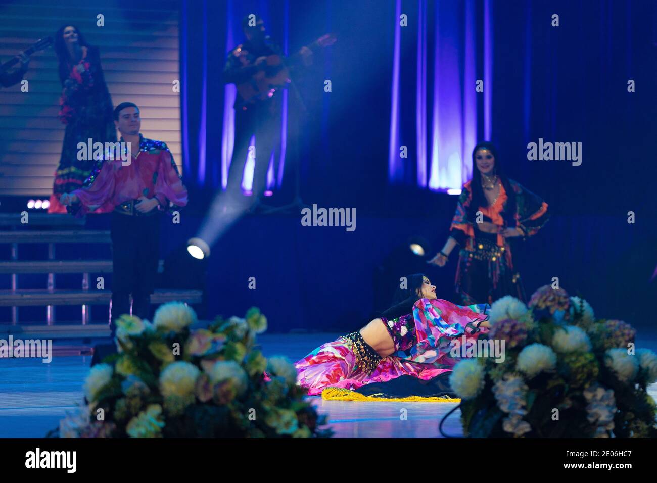 A team of musicians, singers and dancers in gypsy costumes singing and ...