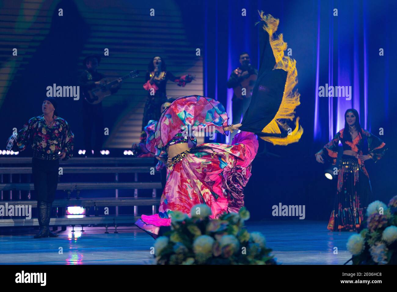 A team of musicians, singers and dancers in gypsy costumes singing and ...