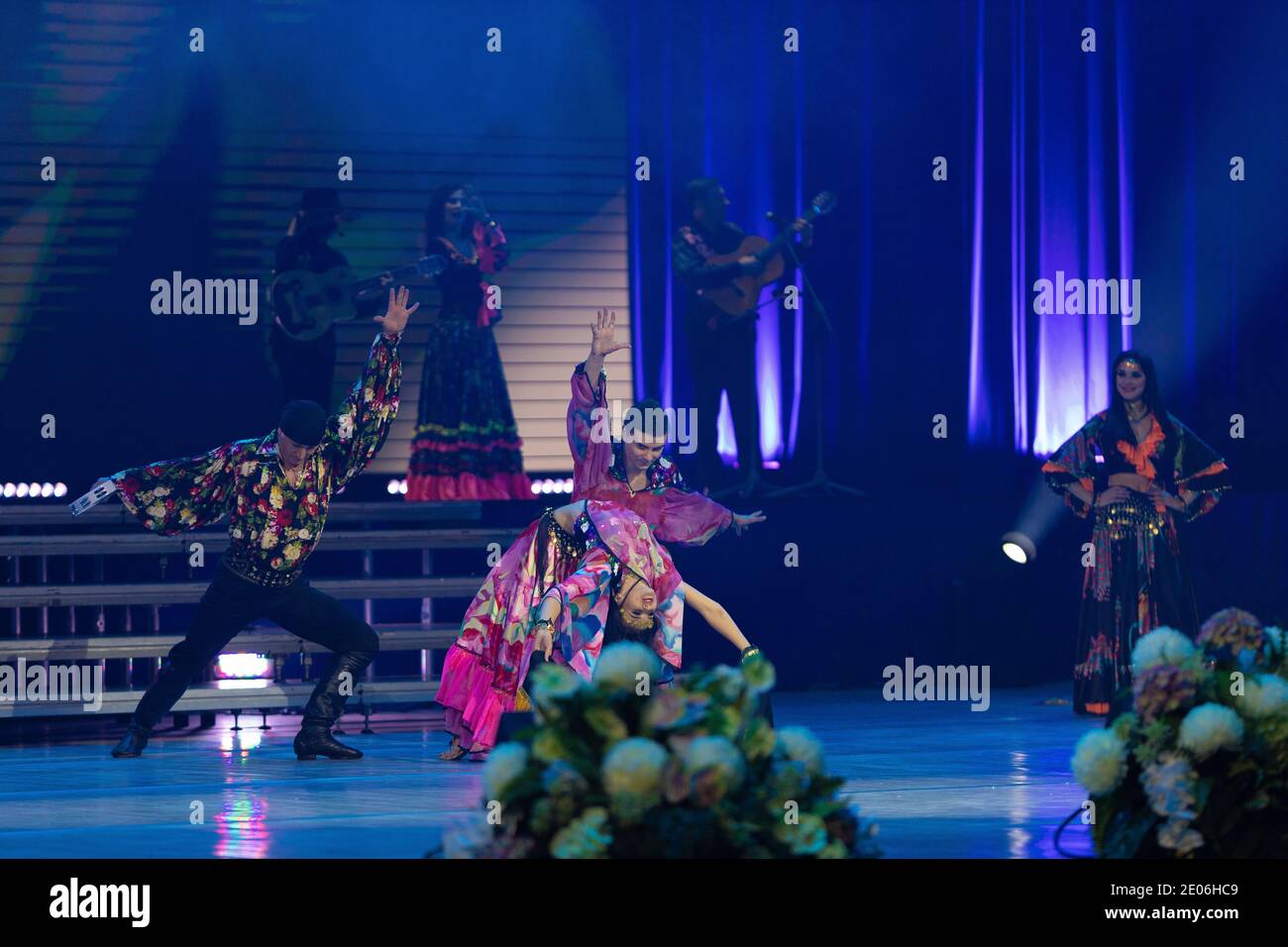 A team of musicians, singers and dancers in gypsy costumes singing and ...