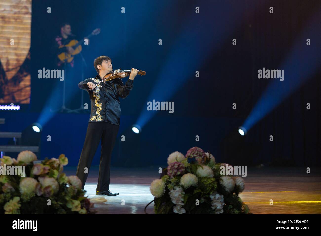 A team of musicians, singers and dancers in gypsy costumes singing and ...