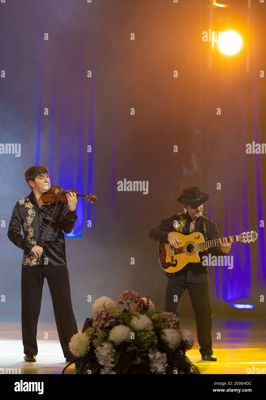 A team of musicians, singers and dancers in gypsy costumes singing and ...