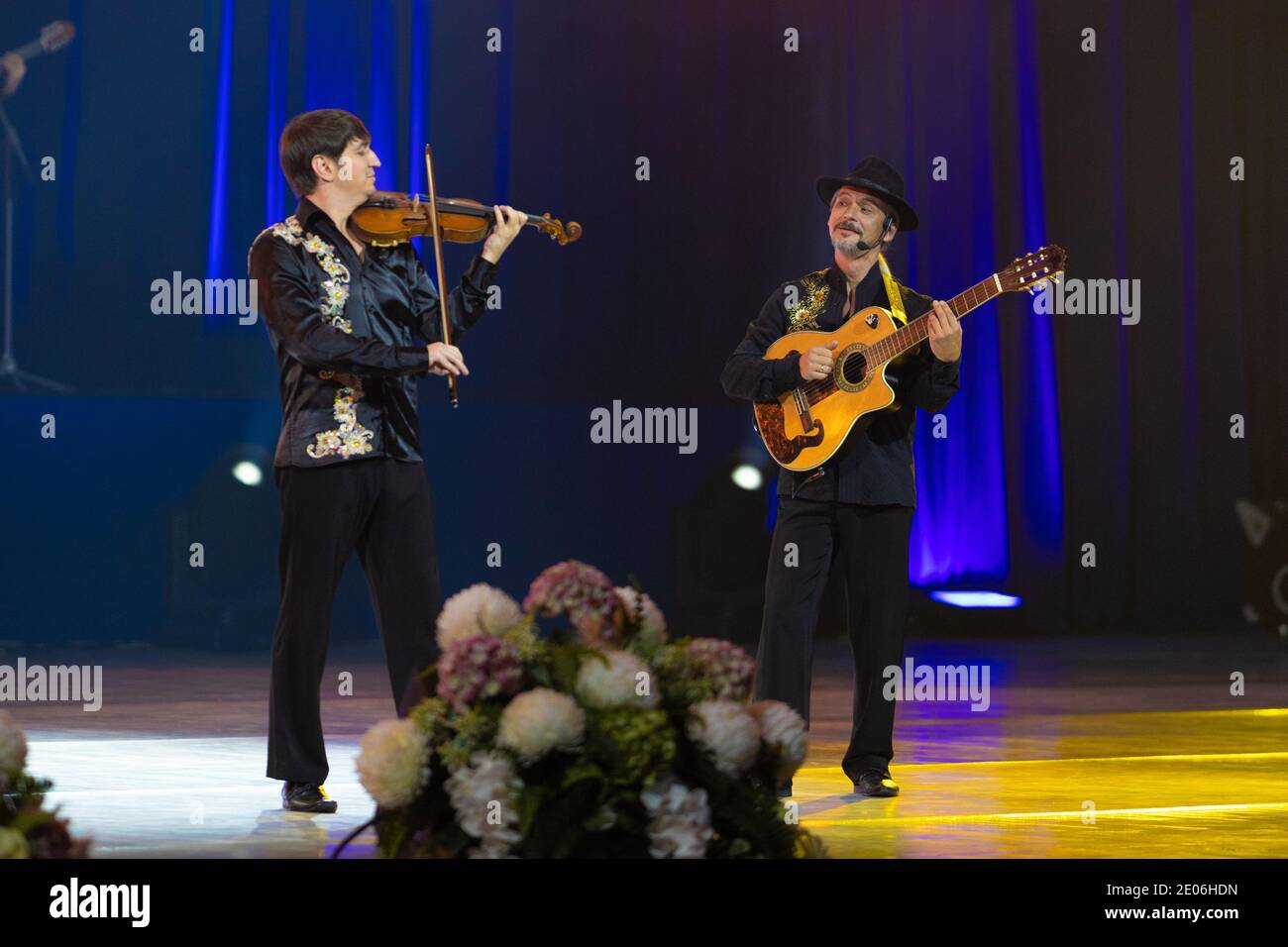 A team of musicians, singers and dancers in gypsy costumes singing and ...