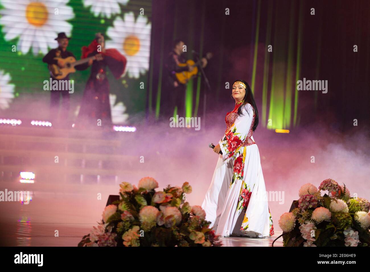 A team of musicians, singers and dancers in gypsy costumes singing and ...