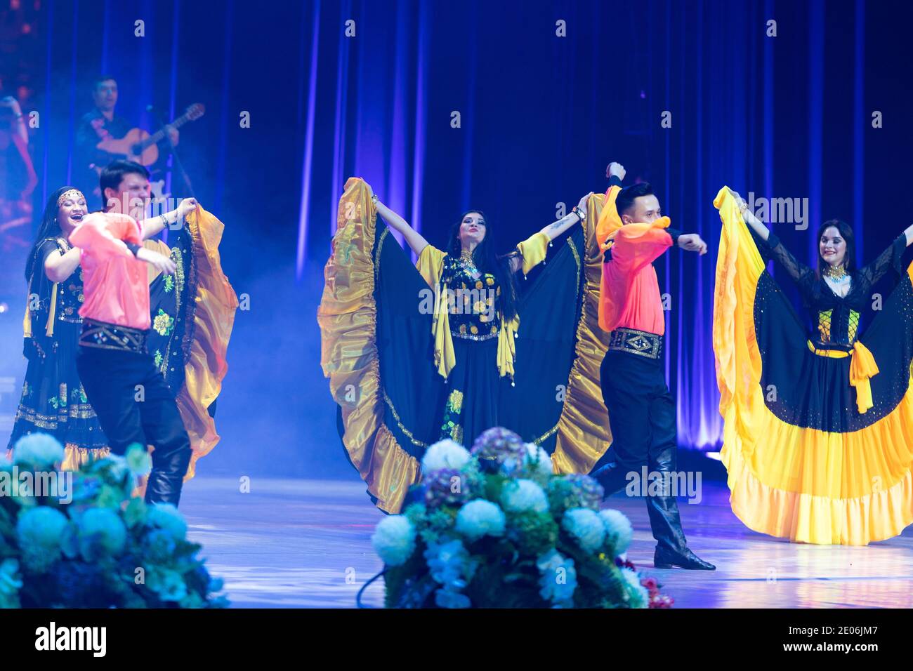 A team of musicians, singers and dancers in gypsy costumes singing and ...