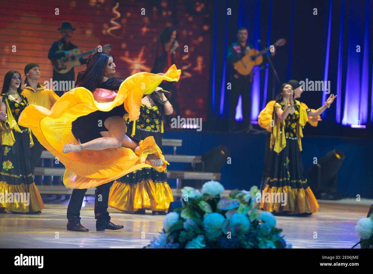 A team of musicians, singers and dancers in gypsy costumes singing and ...