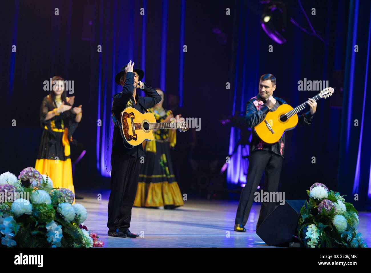 A team of musicians, singers and dancers in gypsy costumes singing and ...