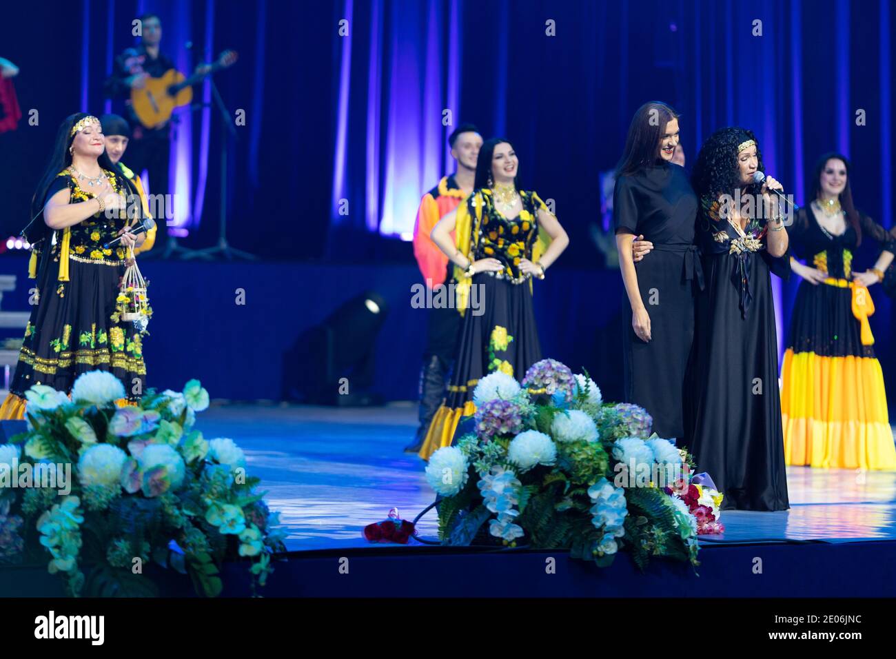 A team of musicians, singers and dancers in gypsy costumes singing and ...