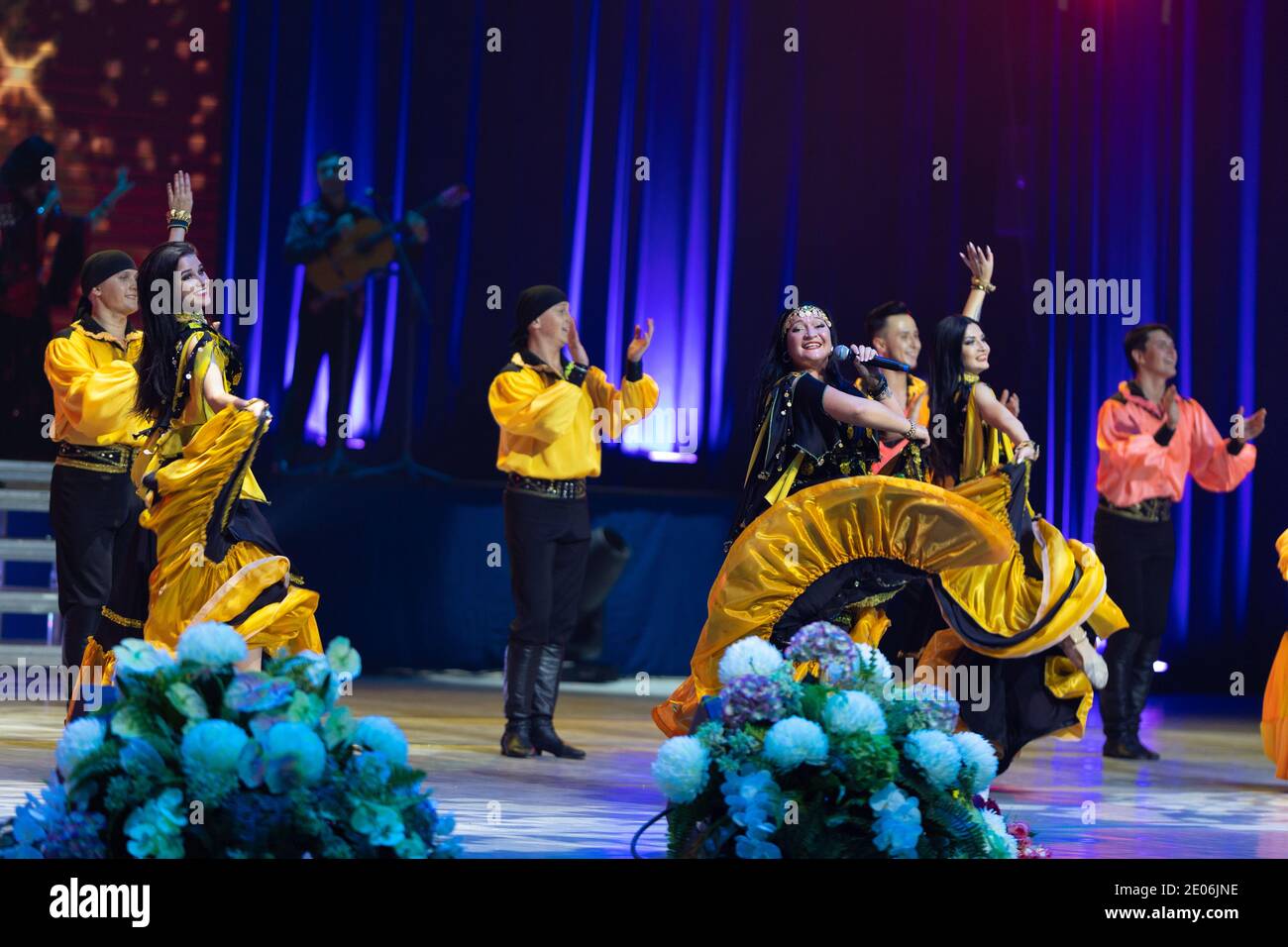 A team of musicians, singers and dancers in gypsy costumes singing and ...