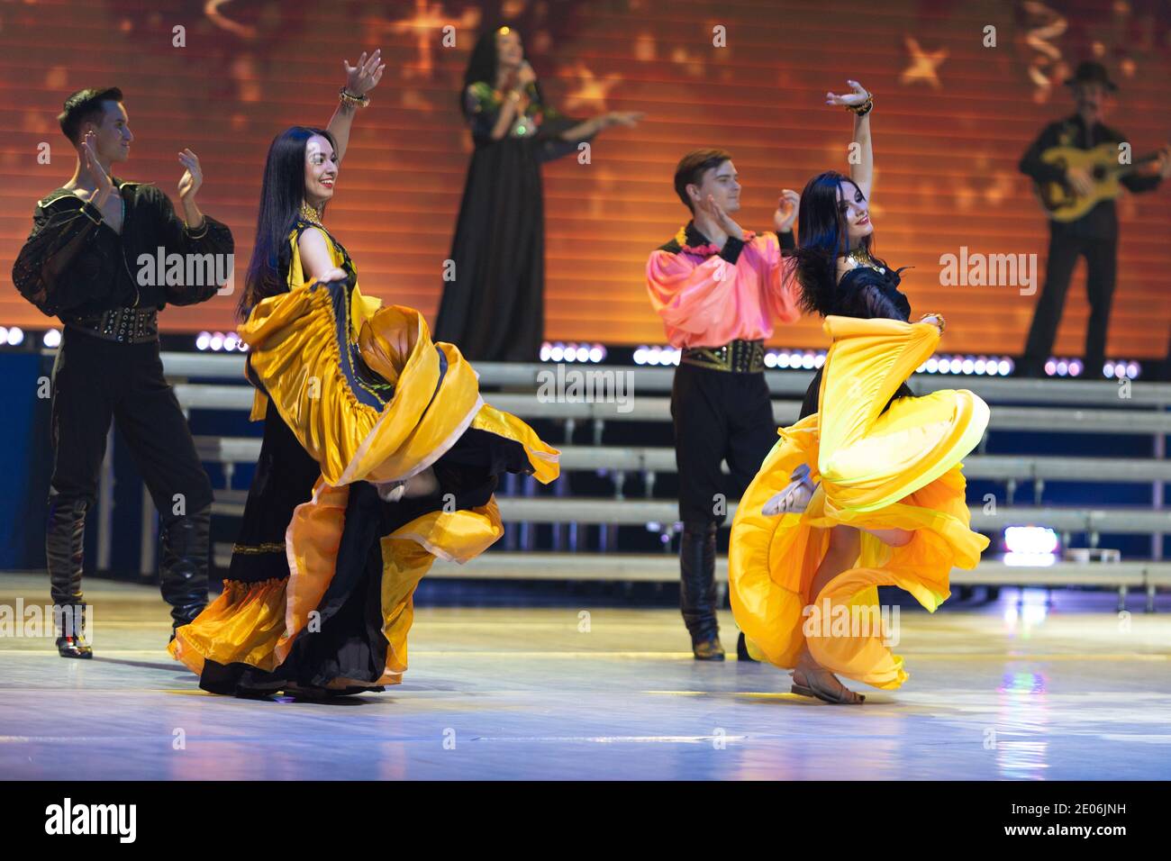 A team of musicians, singers and dancers in gypsy costumes singing and ...