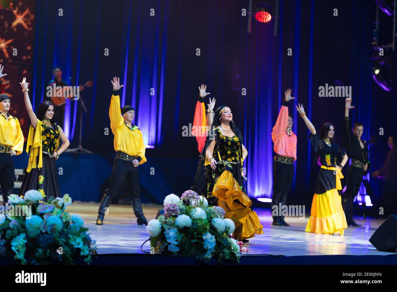 A team of musicians, singers and dancers in gypsy costumes singing and ...