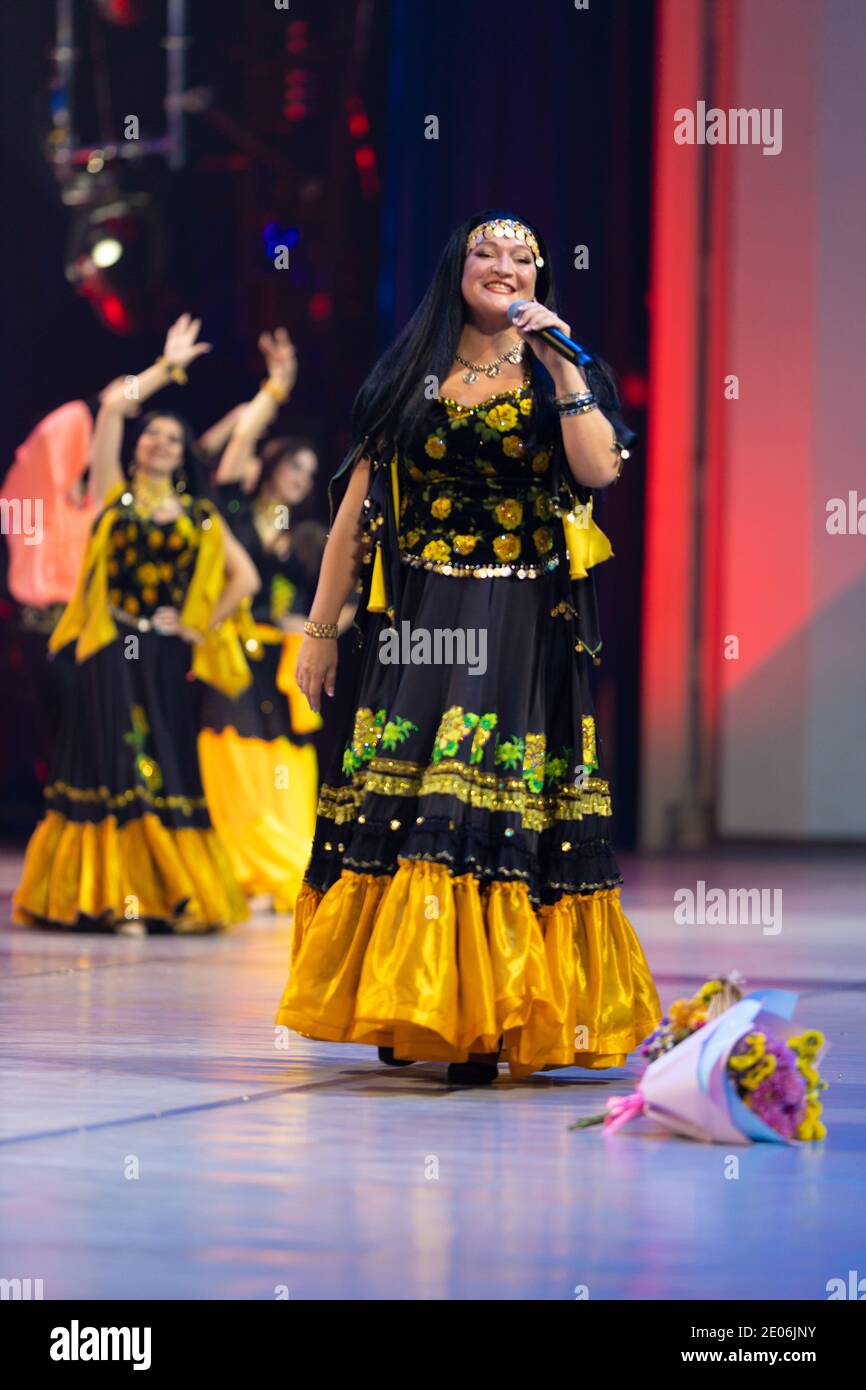 A team of musicians, singers and dancers in gypsy costumes singing and ...