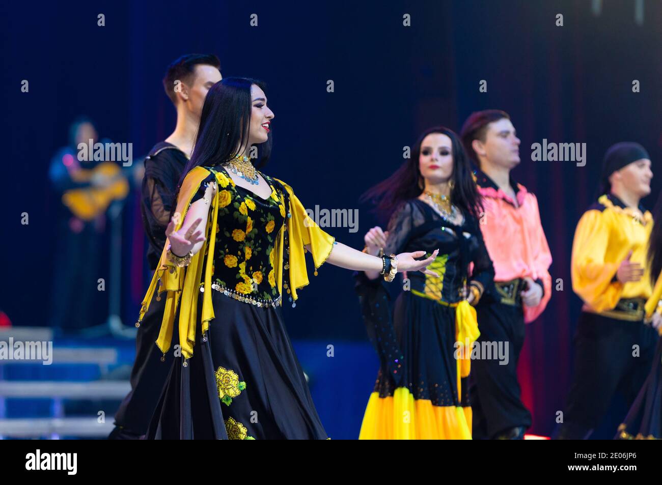 A team of musicians, singers and dancers in gypsy costumes singing and ...